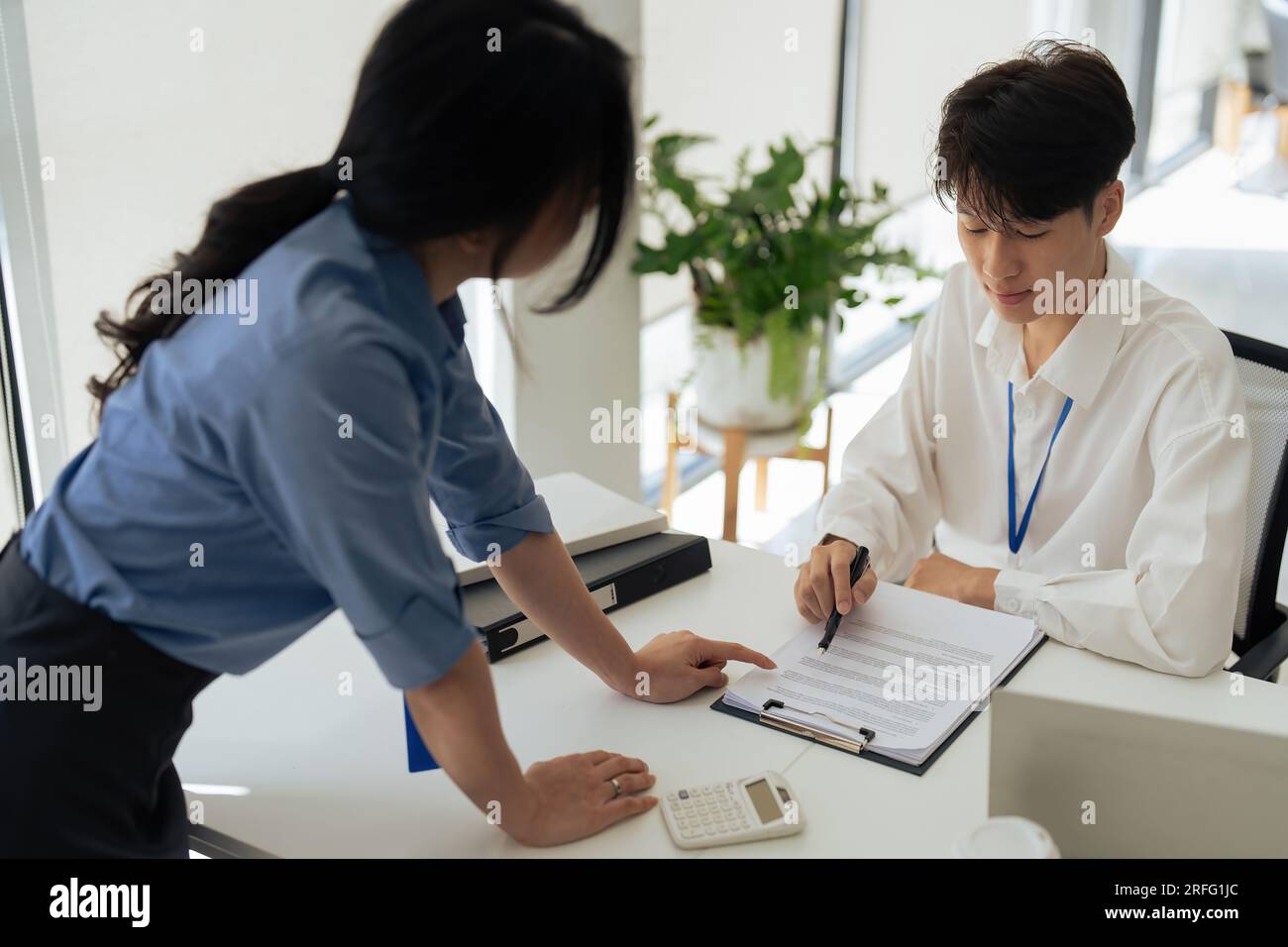 employee discuss report together in the office Stock Photo - Alamy