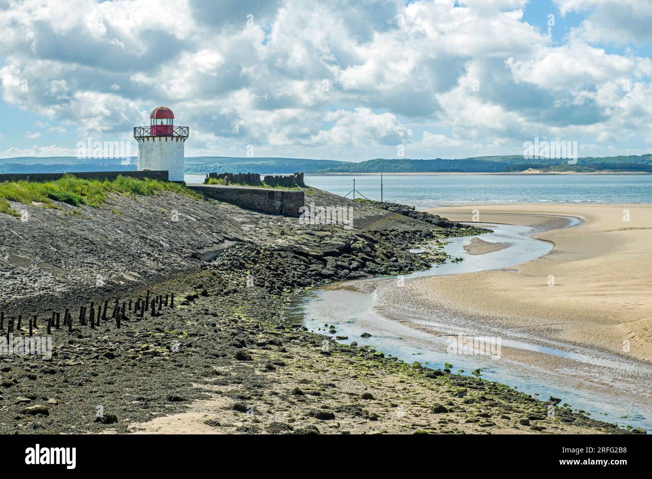 The Lighthouse and Beach at Burry Port at the end of the harbour wall ...