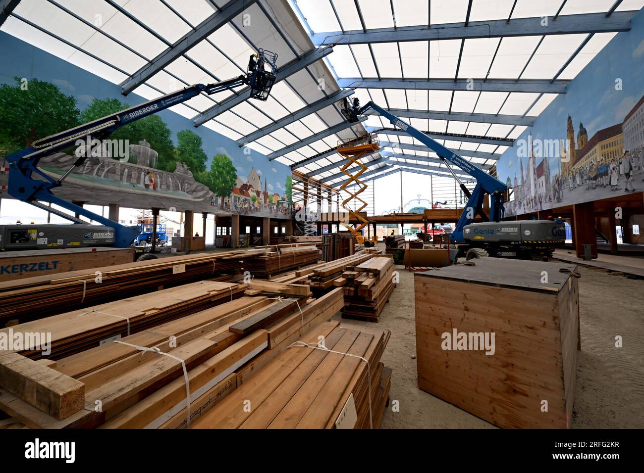 Munich, Germany. 03rd Aug, 2023. Workers stand on a crane in the ...