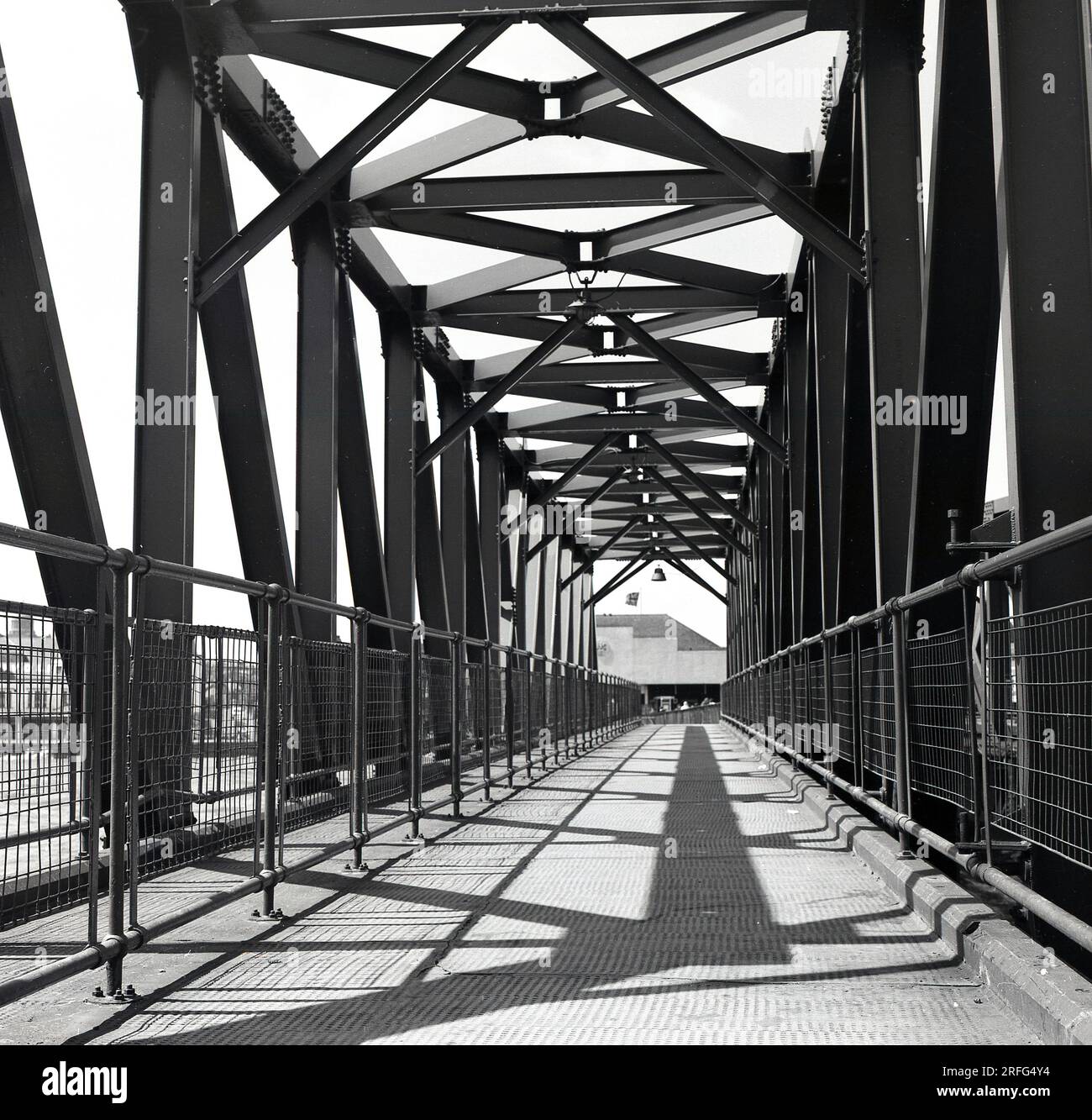1960s, historical, view down a steel framed foot bridge Stock Photo - Alamy