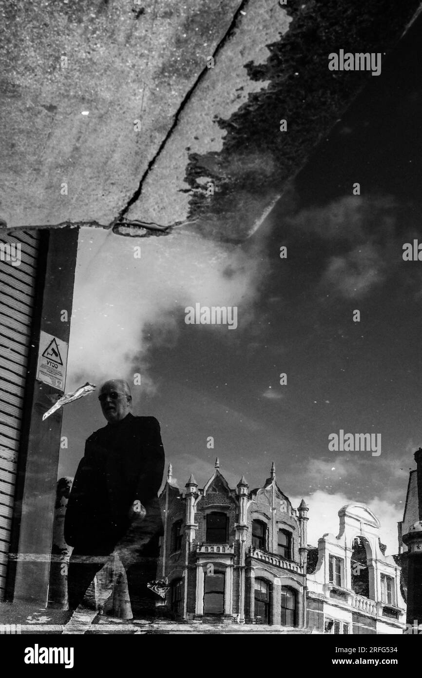 London puddle reflection Black and White Stock Photos & Images - Alamy