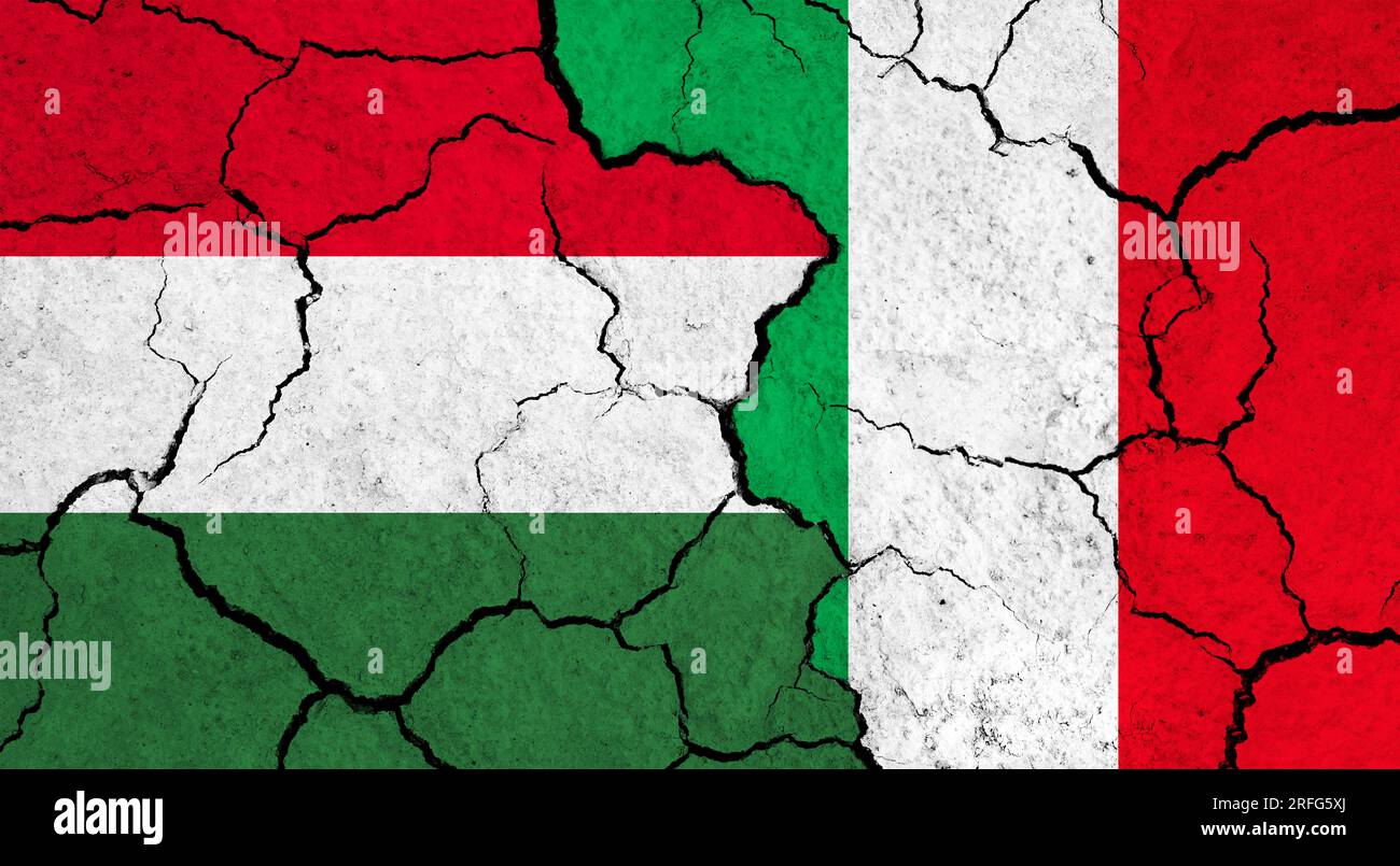 Flags of Hungary and Italy on cracked surface - politics, relationship ...