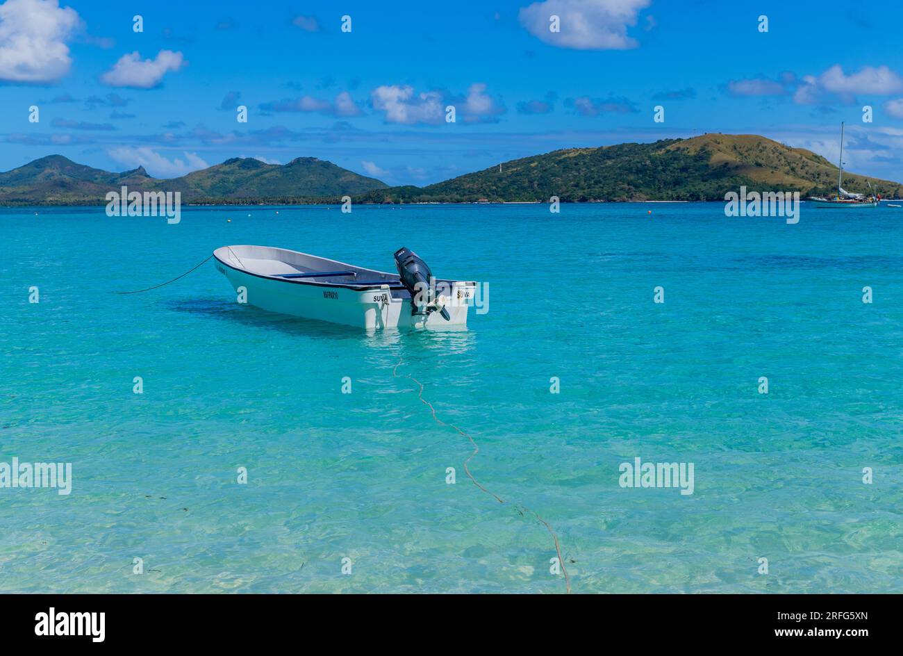 Nacula; Fiji: June 25; 2023: Boats in the stunning idyllic blue lagoon ...