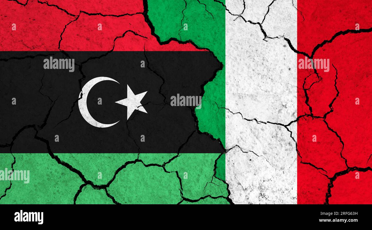 Flags of Libya and Italy on cracked surface - politics, relationship ...