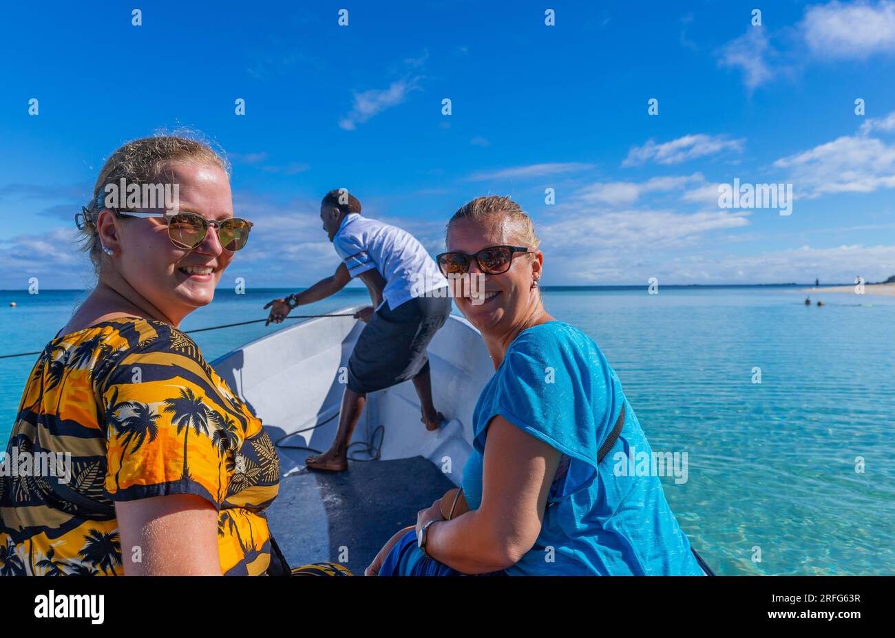 Nacula, Fiji: Tourists in a boat near Nacula island, Yasawa islands ...