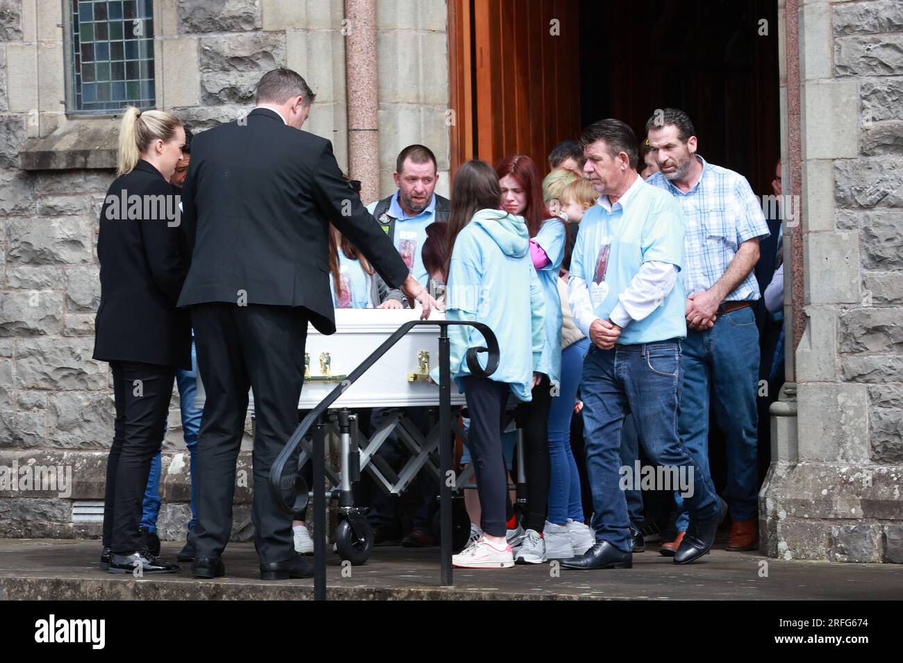 Mourners gather around the coffin of Kiea McCann outside the Sacred ...