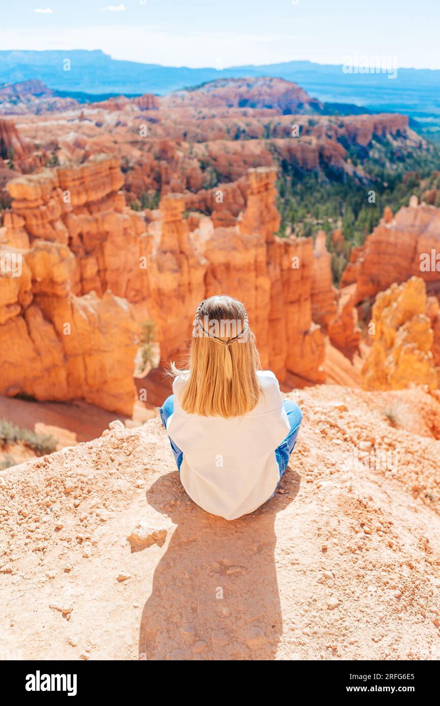 Little girl in Bryce Canyon hiking relaxing looking at amazing view ...