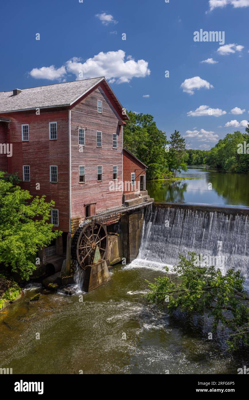 An old red grist mill with water wheel and dam Stock Photo - Alamy
