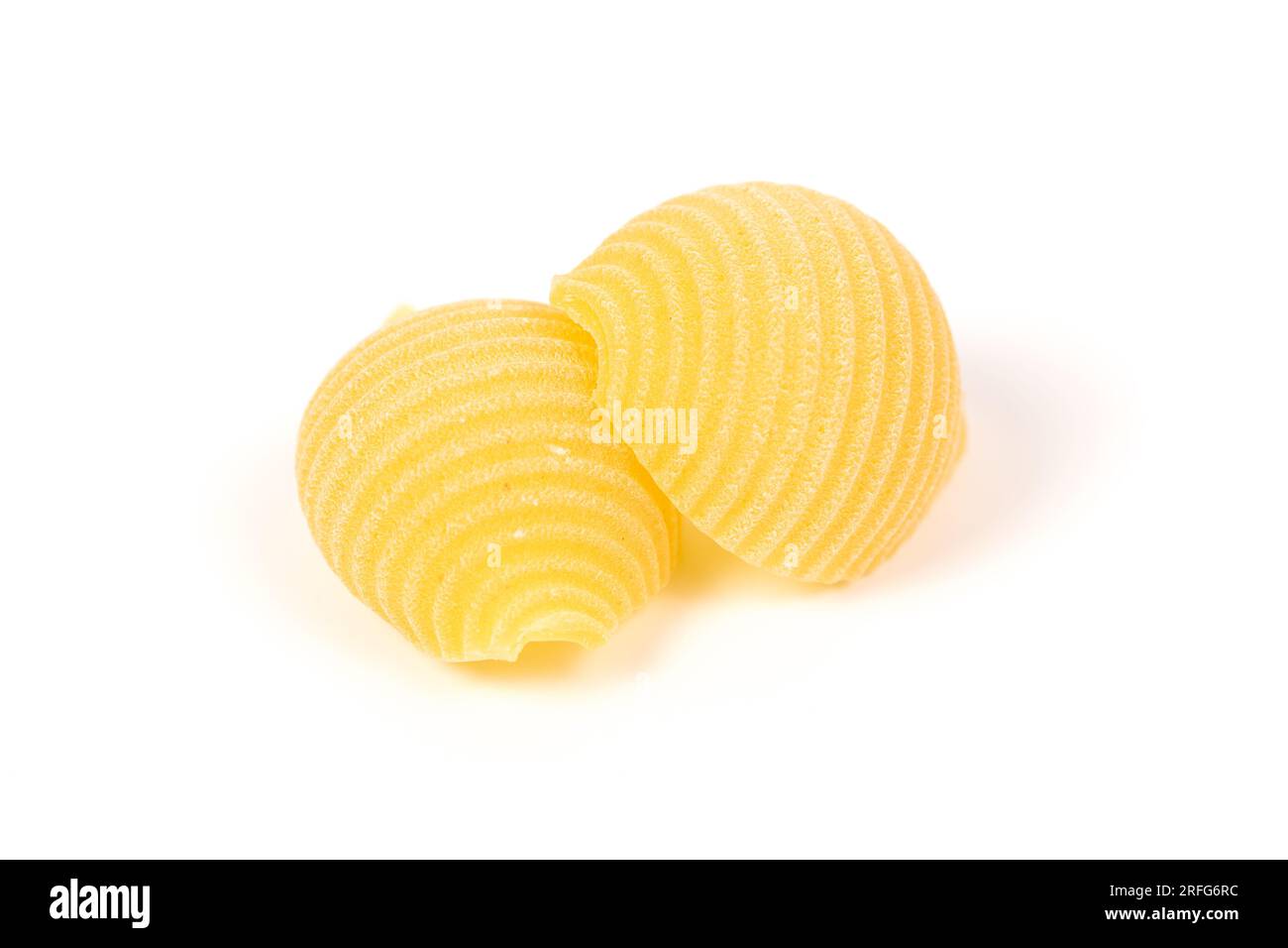 conchiglie rigate pasta pieces isolated on white background Stock Photo ...