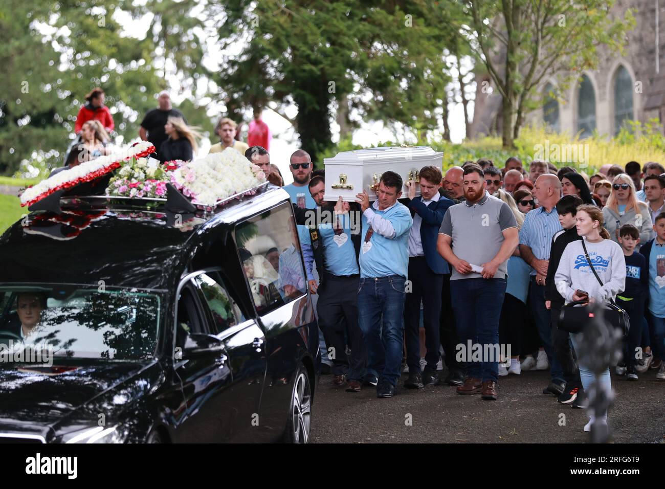 Pallbearers carry the coffin of Kiea McCann after her funeral service ...