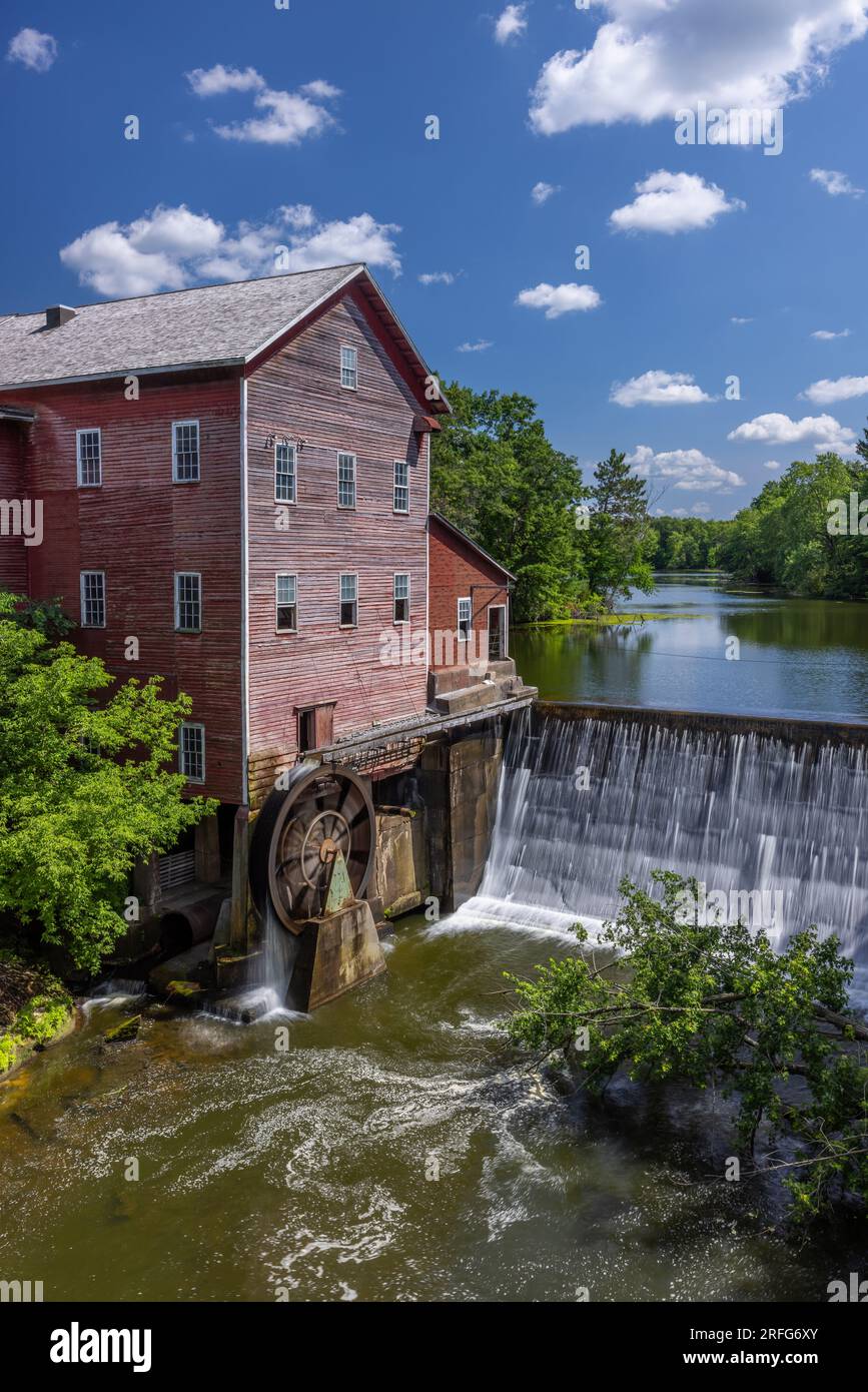 An old red grist mill with water wheel and dam Stock Photo - Alamy