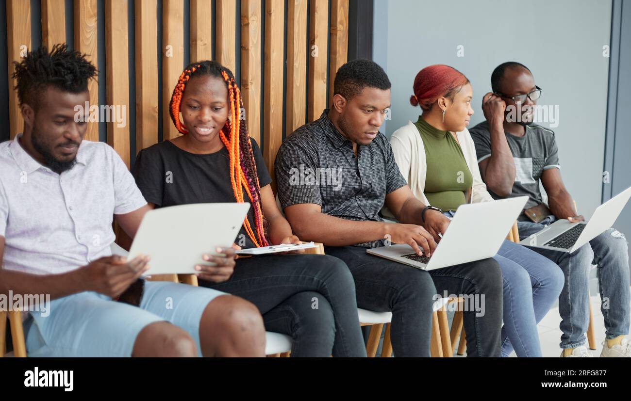 Group of diverse people are waiting for a job interview Stock Photo - Alamy