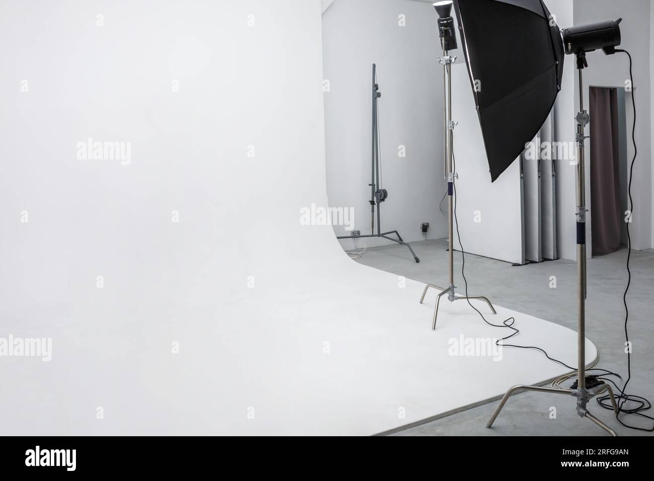 interior of bright space of photo studio with large white cyclorama ...