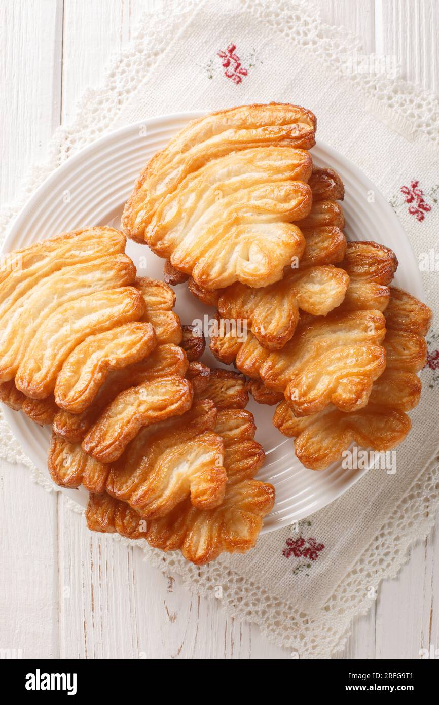 Italian Palmine puff pastry cookies coated with sugars closeup on the ...