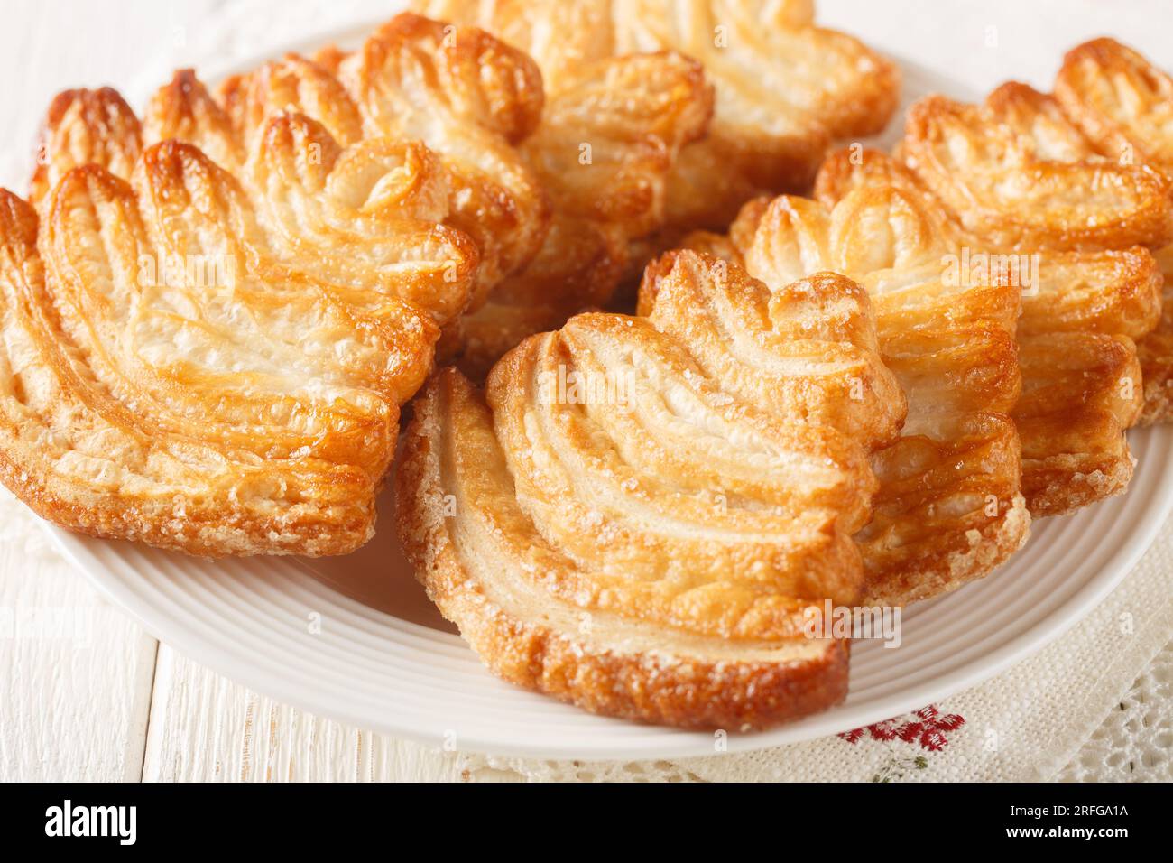 Tasty puff pastry in a palm leaf shape called Palmier closeup on the ...