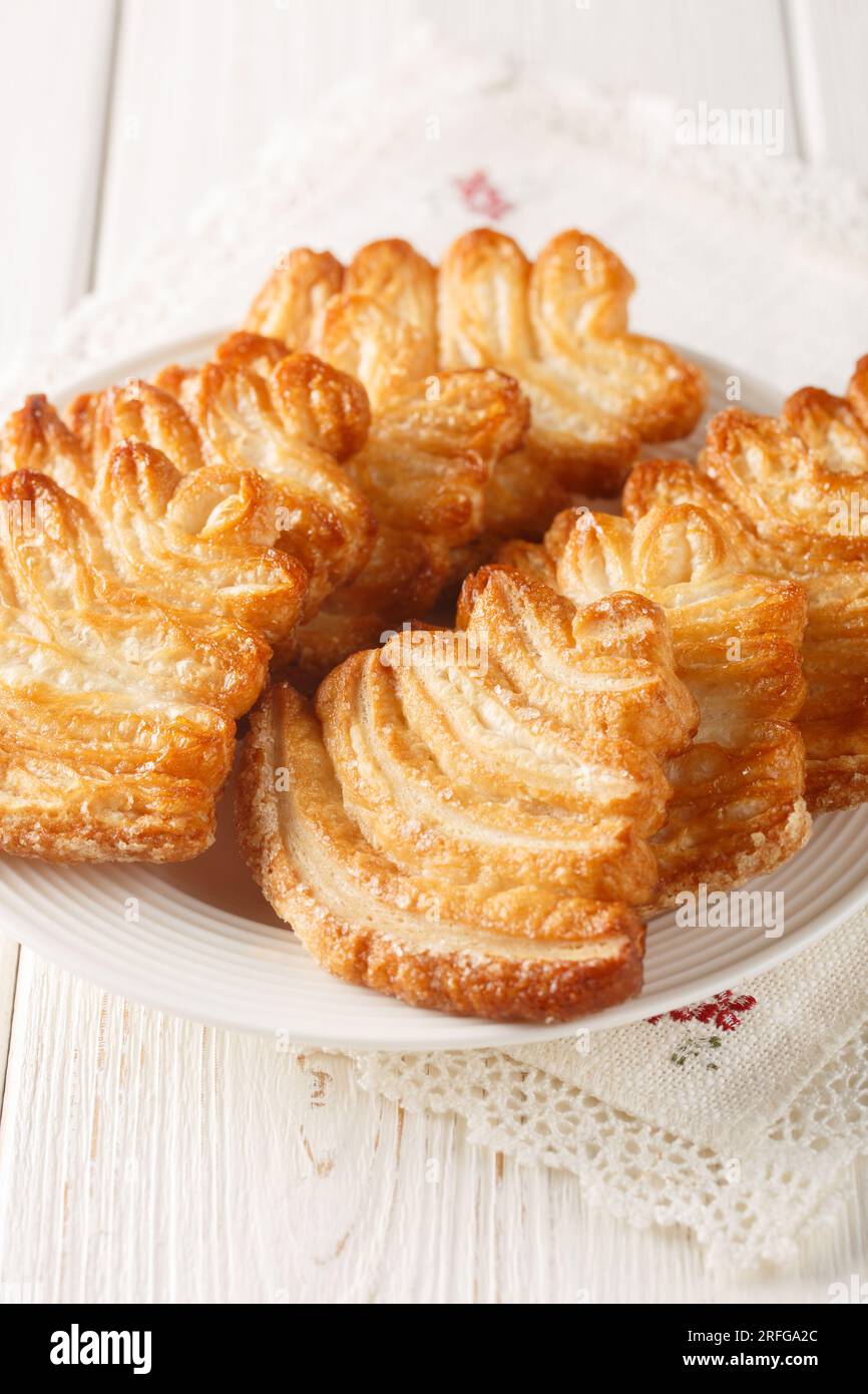 Italian puff pastry Palmine pasta sfoglia closeup on the plate on the ...
