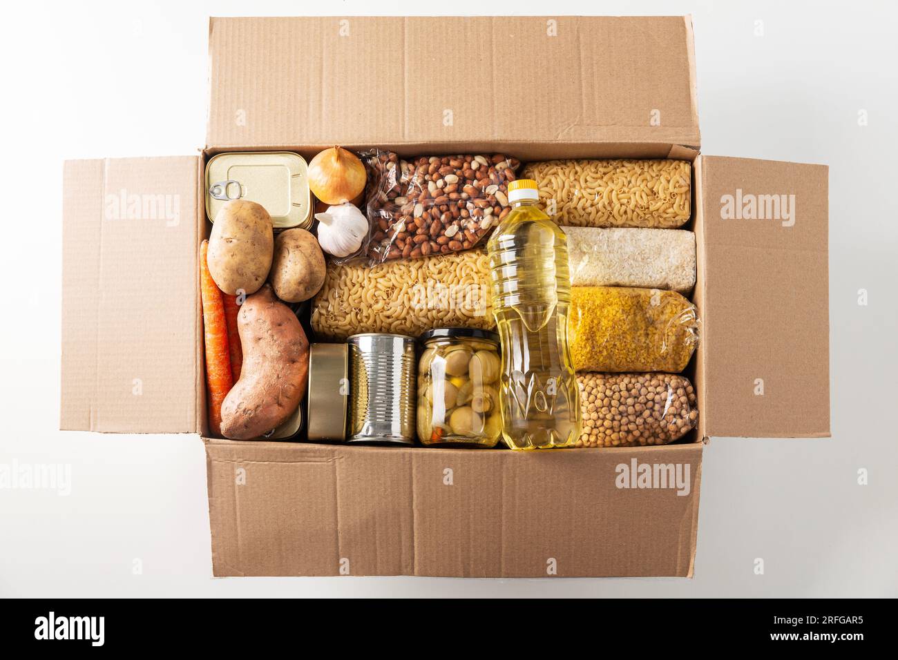 food storage, donation and eating concept - close up of box with ...