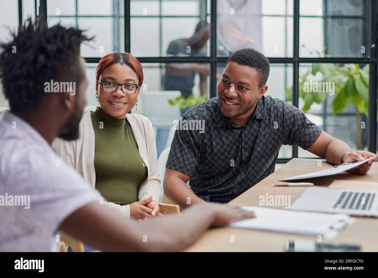 young business people discussing everyday working moments Stock Photo ...