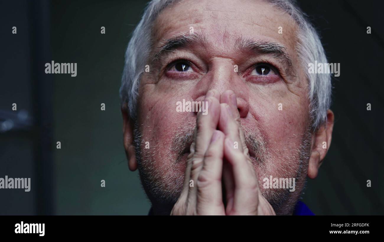 Religious Elderly Man Praying to GOD with eyes closed in Spiritual ...