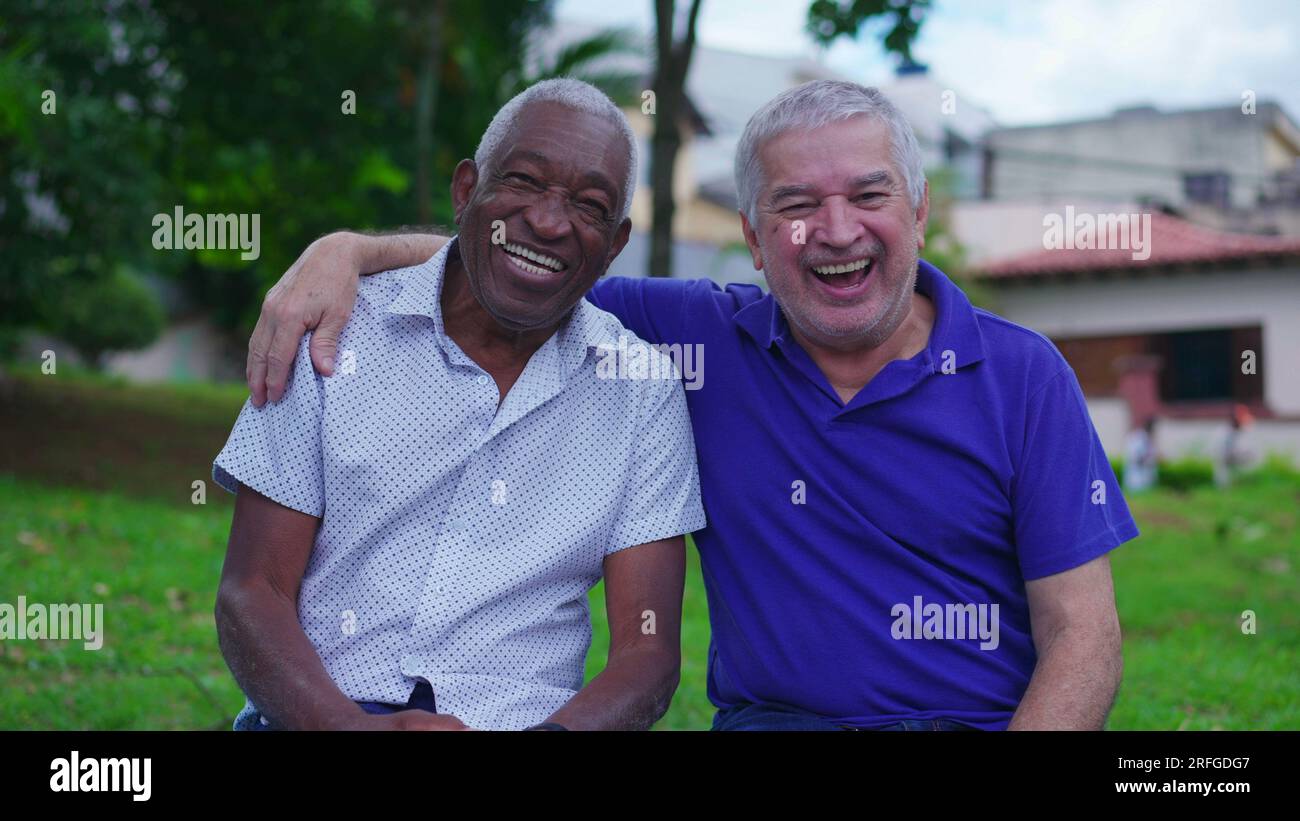 Older Caucasian and African American Friends Share Happy Moment on Park ...