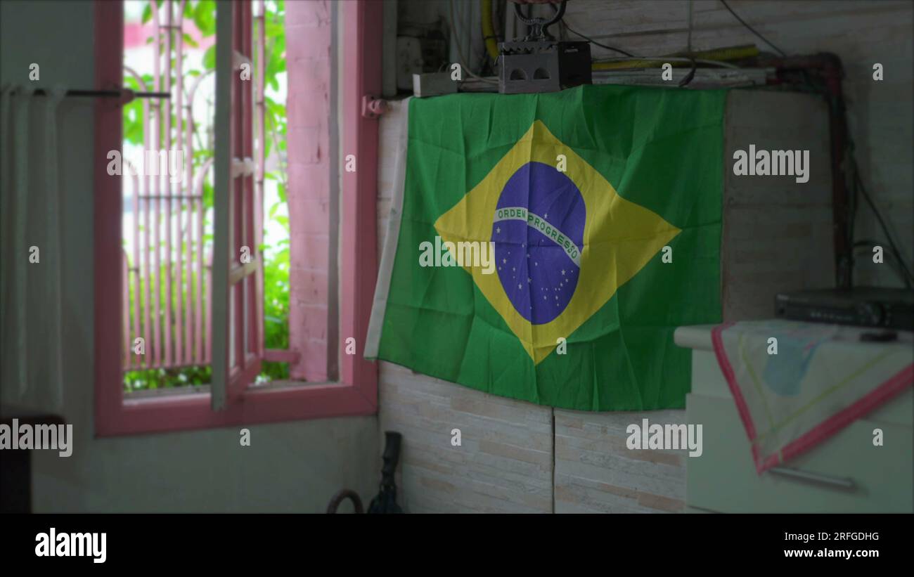 Patriotic Display in Brazil of a Brazilian Flag hanging by Window Stock ...