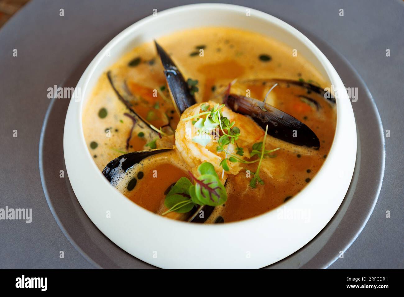 Shrimp Bisque with Seafood. King prawn, blue mussels, cod, whipped ...