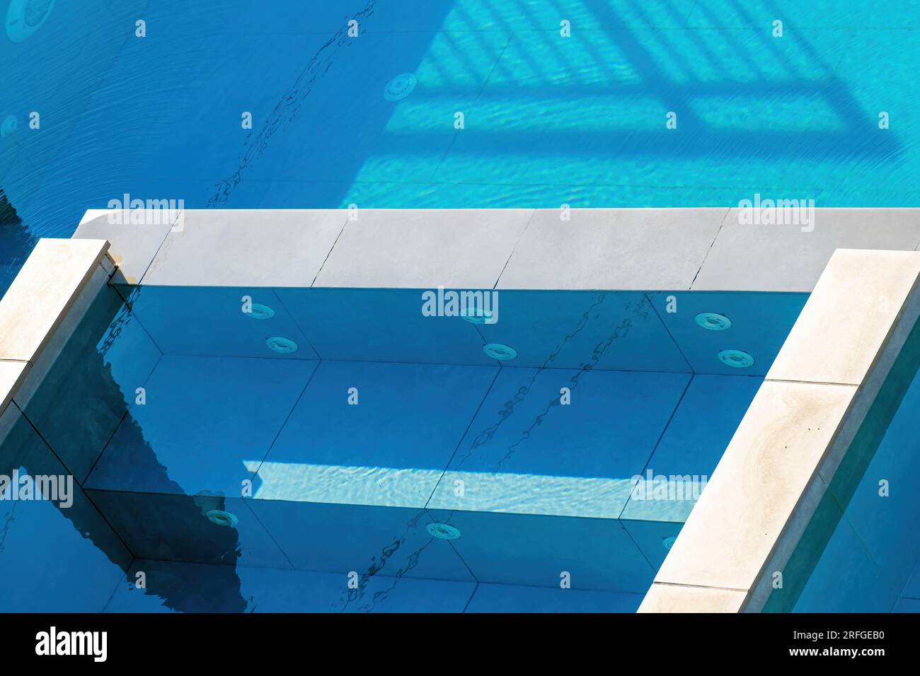 summertime outside pool with clear blue water Stock Photo - Alamy