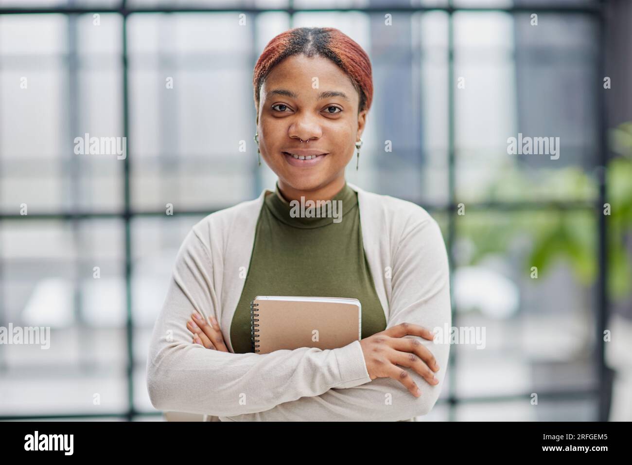 Close-up photo of a pretty, pensive dark-skinned girl, student, manager ...