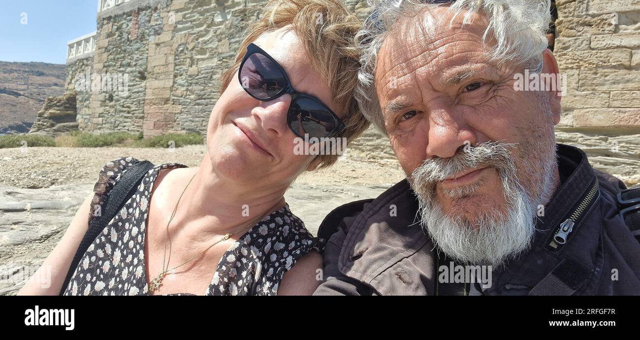 Mature couple on holiday, selfie, Chora, Andros island, Greece ...