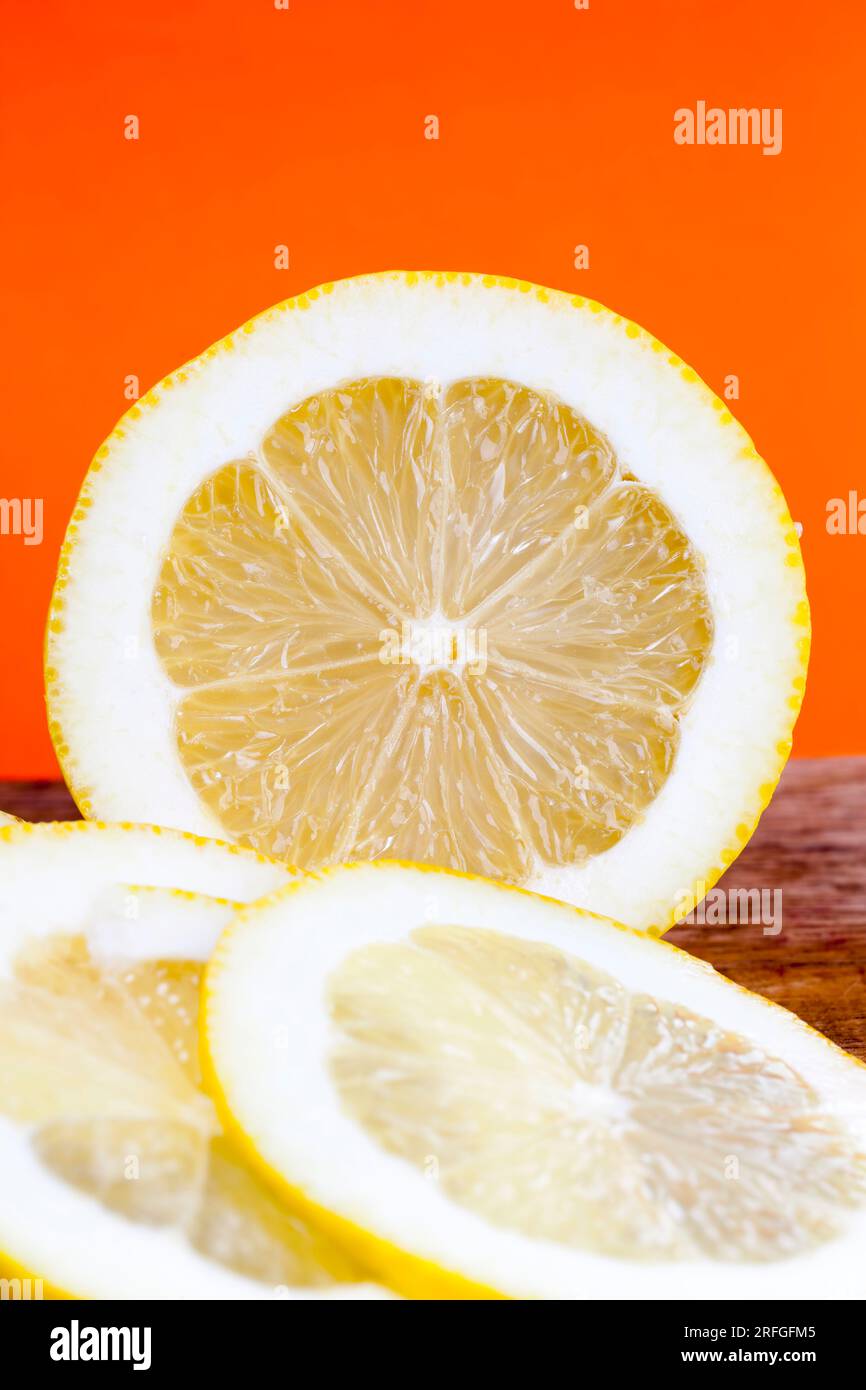 fresh juicy lemon cut into pieces while cooking close up Stock Photo ...
