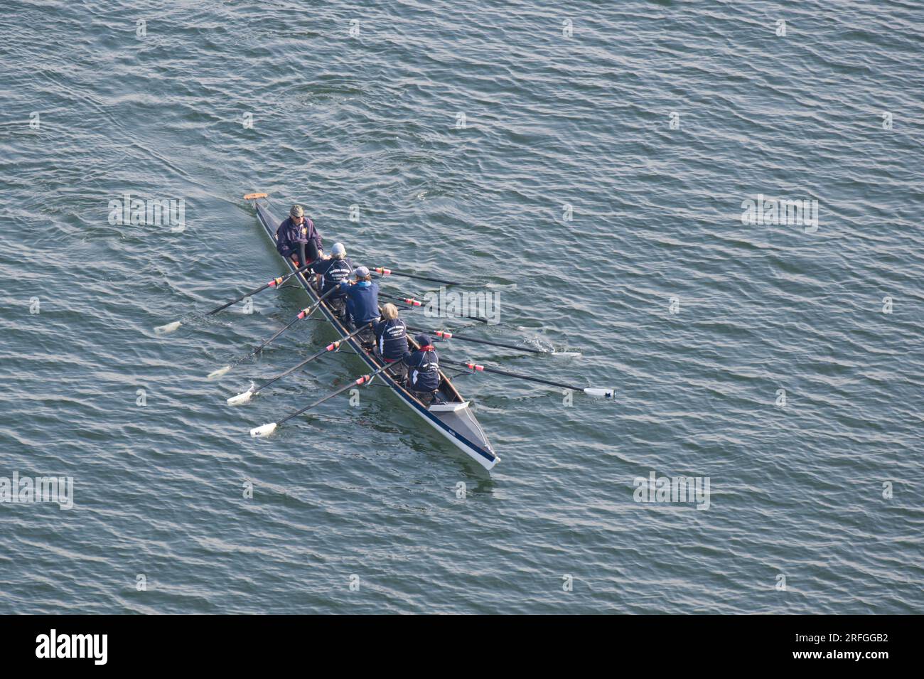 5 people rowing in a small boat, Kiel Germany Stock Photo - Alamy