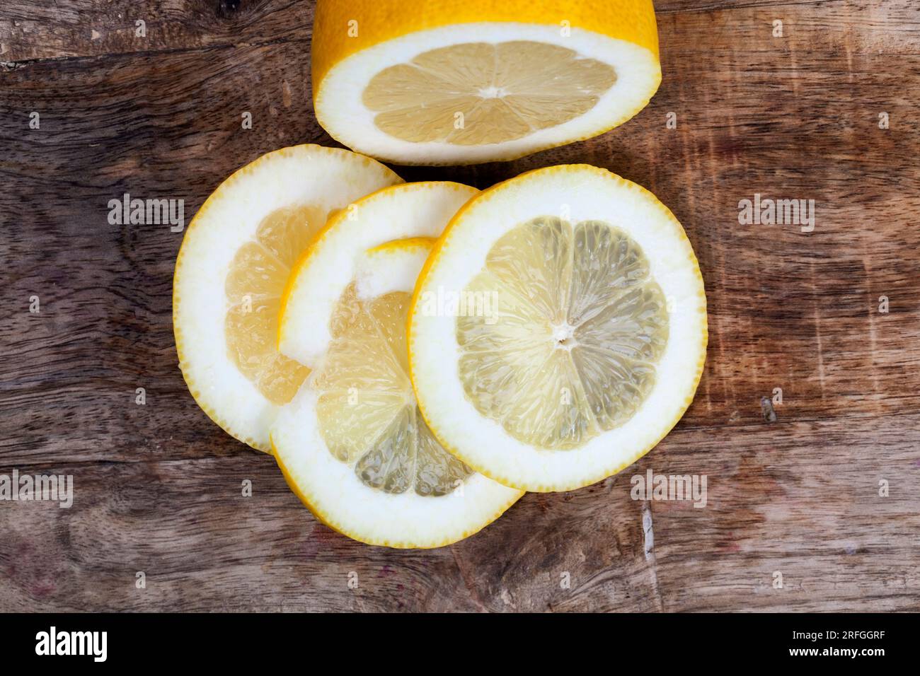 fresh juicy lemon cut into pieces while cooking close up Stock Photo ...