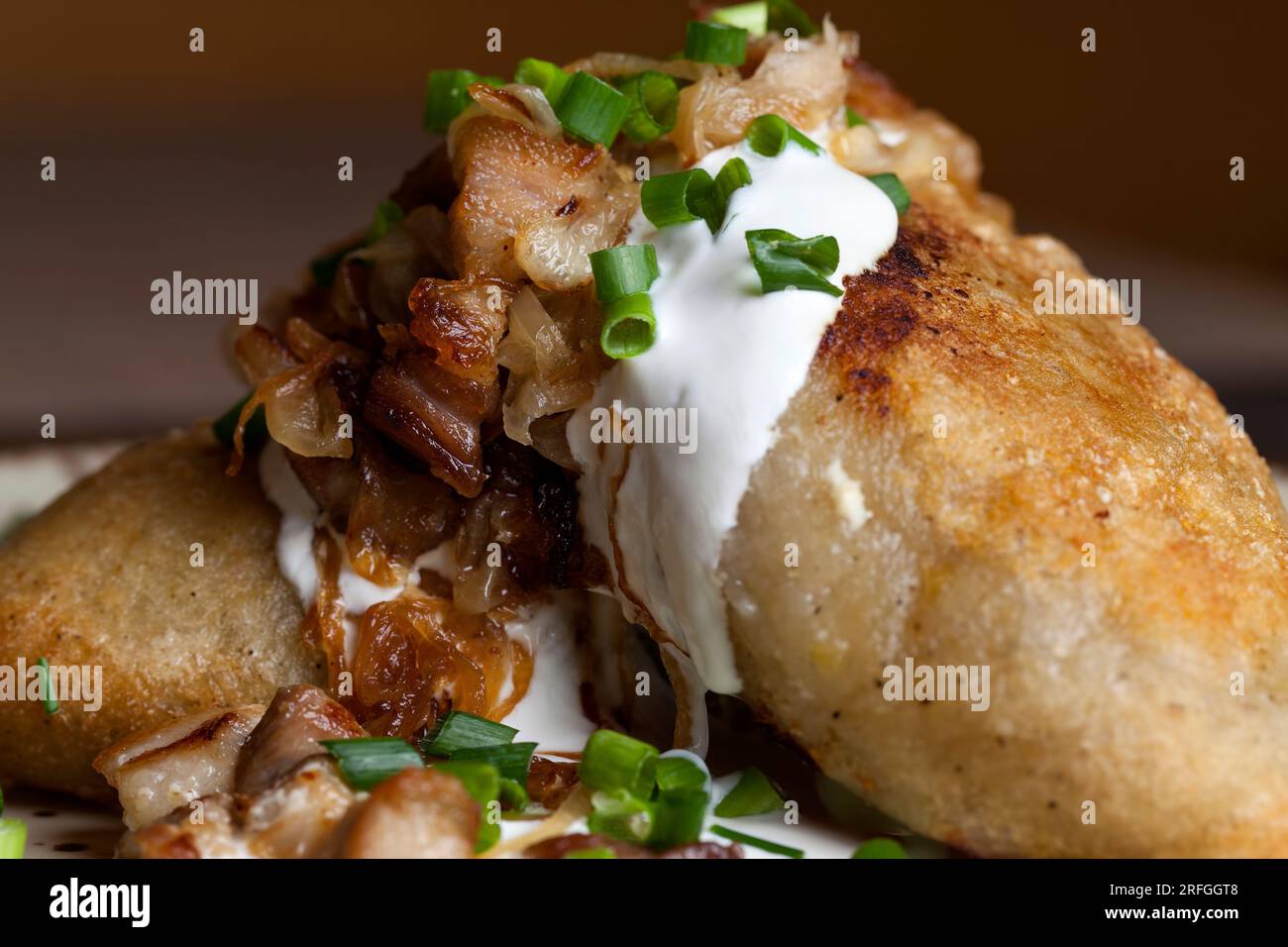 traditional Lithuanian dish served with sour cream and fried bacon ...