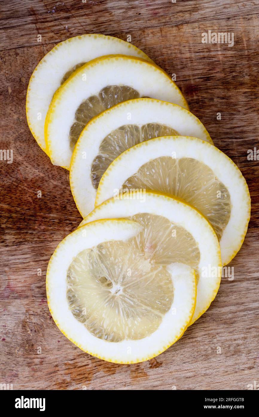 fresh juicy lemon cut into pieces while cooking close up Stock Photo ...