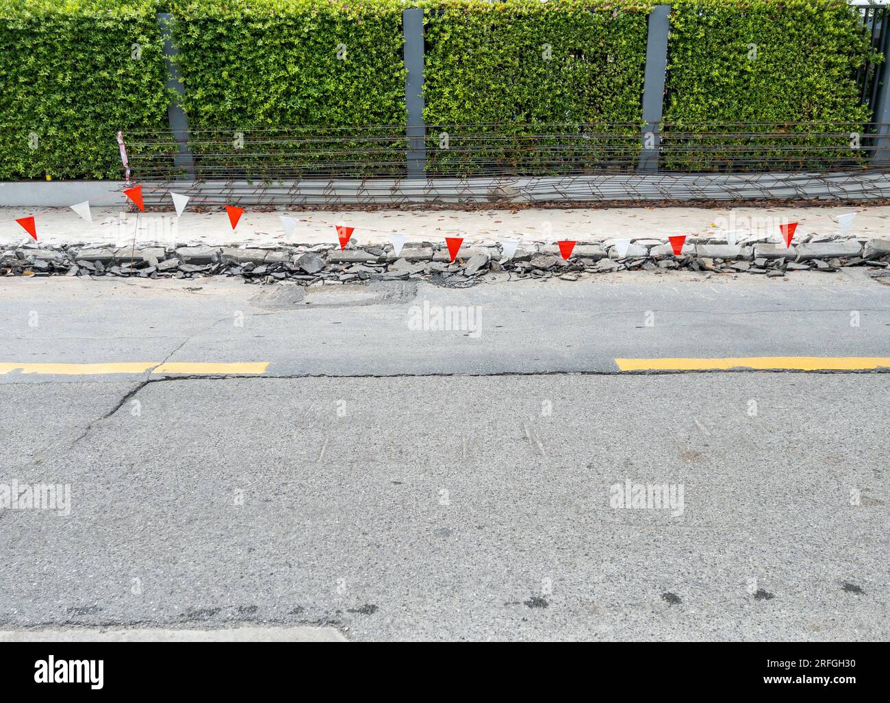 The footpath way is broken from the drilling machine for paving new ...