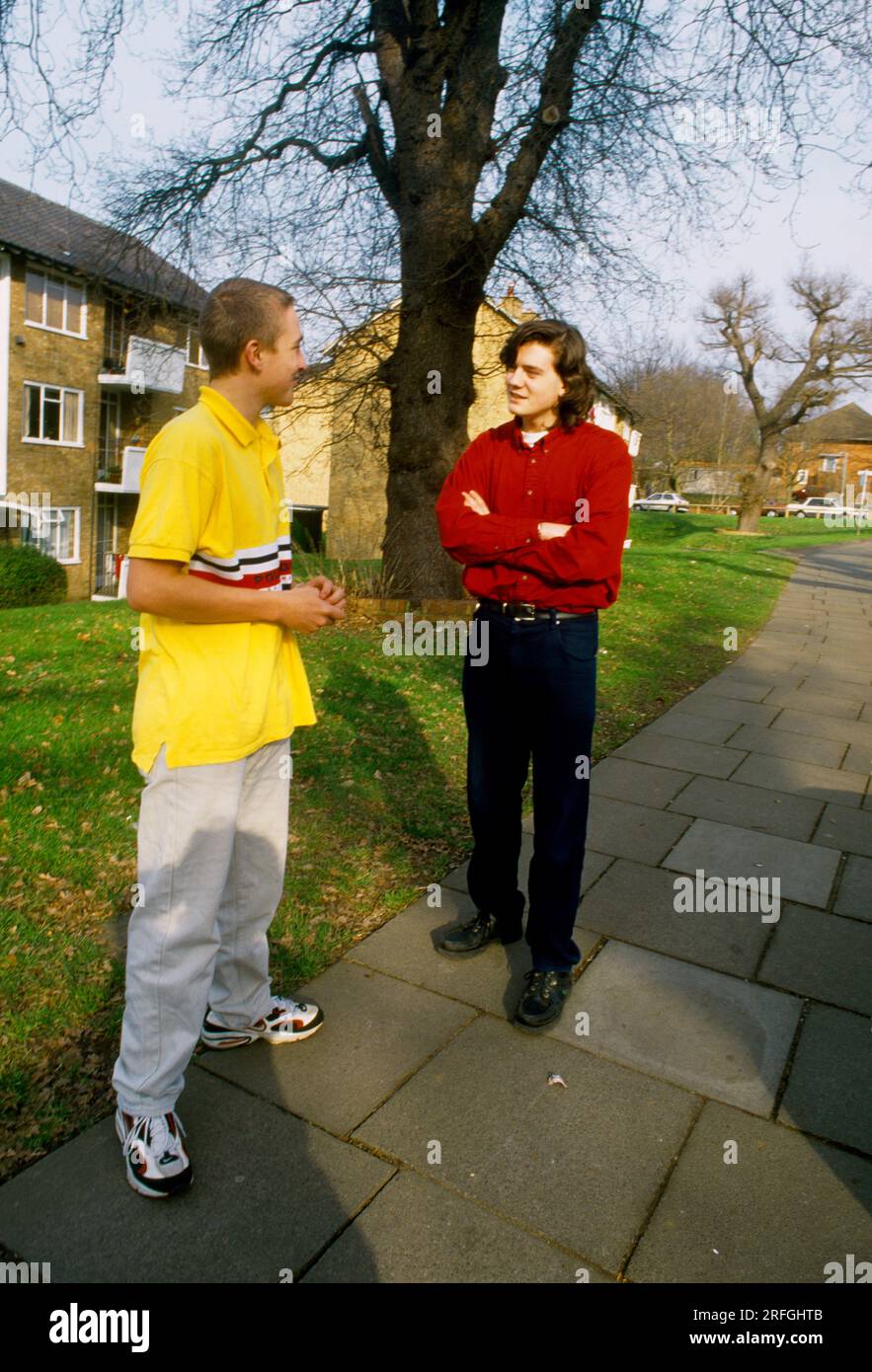 Two Teenage Boys Who Are Friends having a Conversation in the Street ...