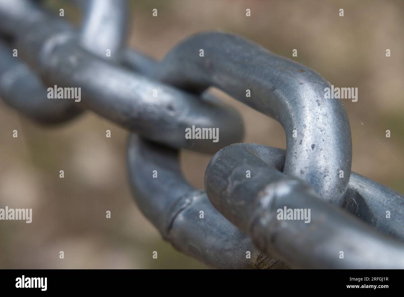 Macro photography with bokeh of iron chain links Stock Photo - Alamy