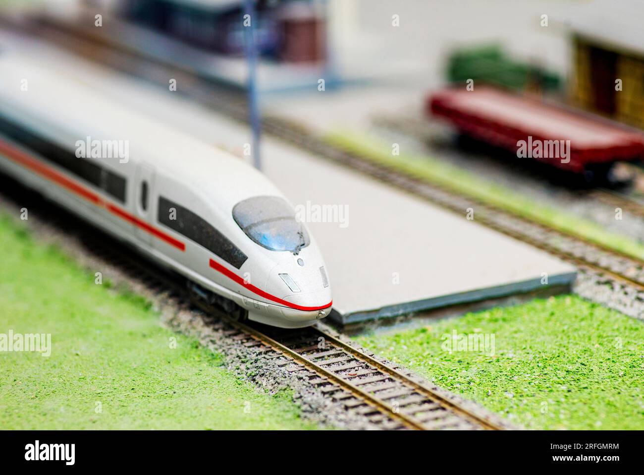 Train model and railroad tracks with scenery Stock Photo - Alamy
