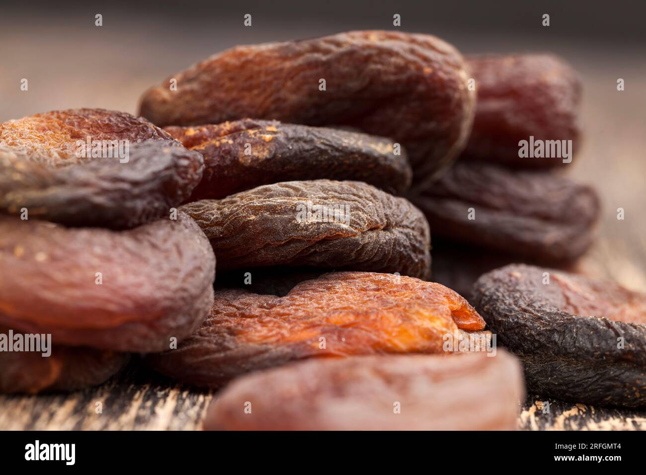 dark dried apricots of large size, dried apricots in sunlight with ...