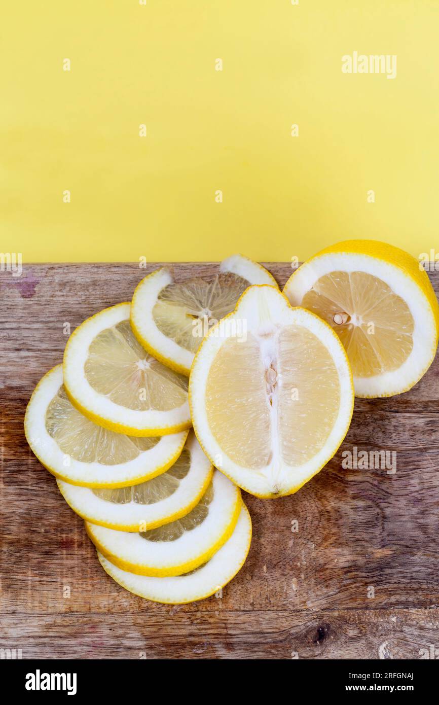 fresh juicy lemon cut into pieces while cooking close up Stock Photo ...