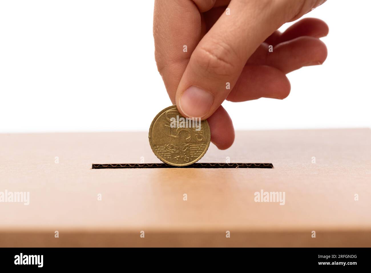 hand putting coin into charity donation box Stock Photo - Alamy