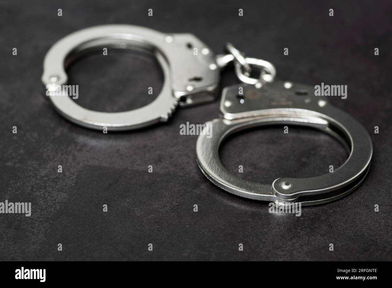 The metal handcuffs on black background. Handcuff or shackle. Police ...