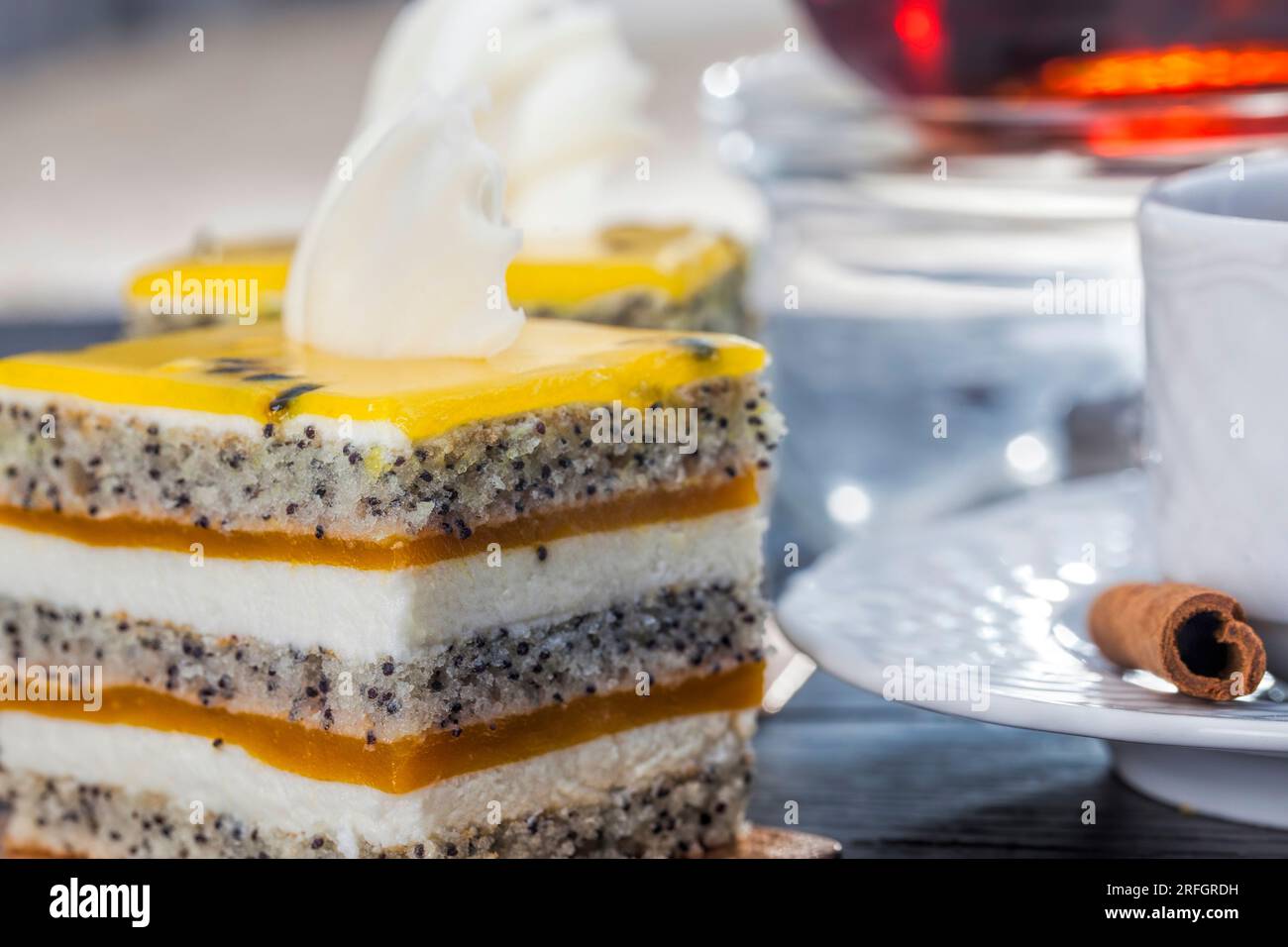 multi layered cake with cakes, fruit peach jelly, poppy seeds and ...