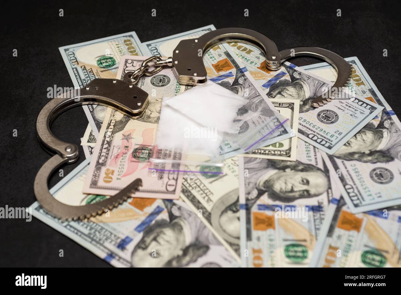 Money, drugs and handcuffs Stock Photo - Alamy