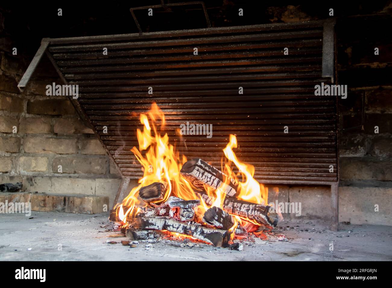 Fire place with burning timber and charcoal for barbeque Stock Photo ...