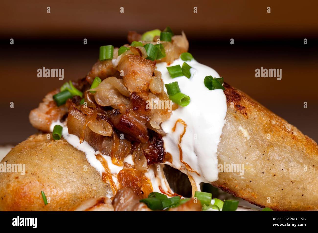 a traditional Lithuanian dish served with sour cream and fried bacon ...