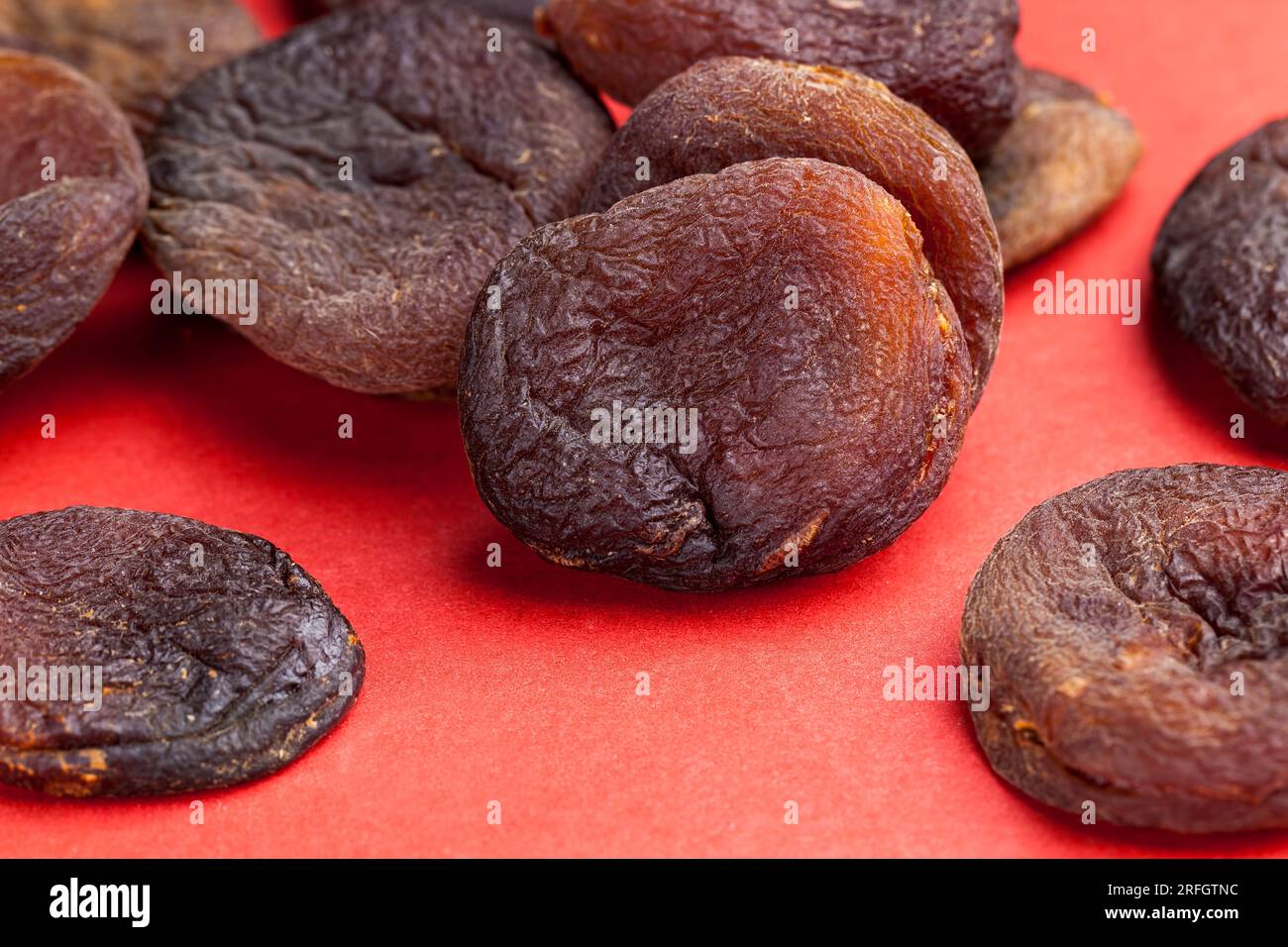 dark dried apricots of large size, dried apricots in sunlight with ...