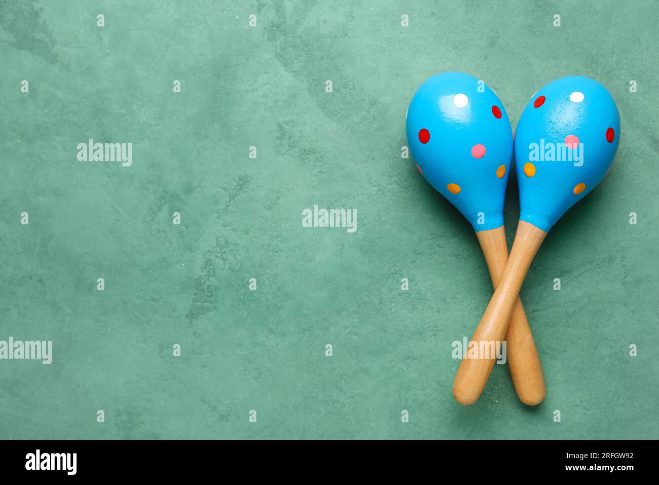 Mexican maracas on green background Stock Photo - Alamy