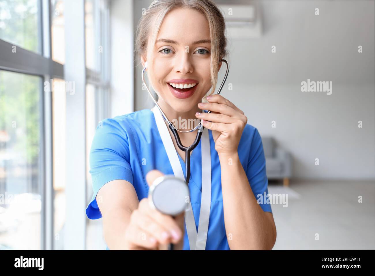 Female medical intern with stethoscope in clinic, closeup Stock Photo ...