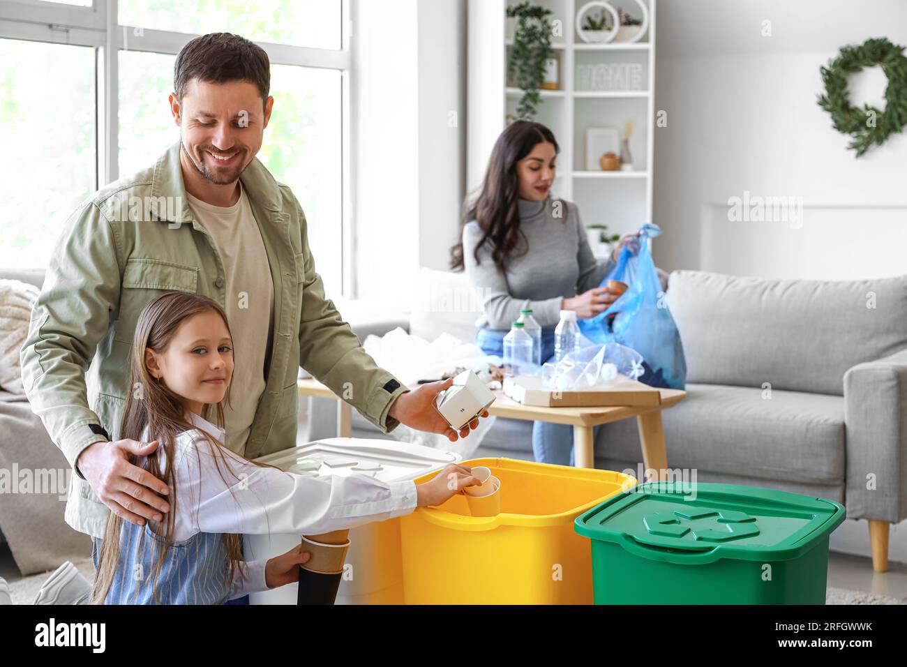 Family sorting paper garbage in recycle bins at home Stock Photo - Alamy